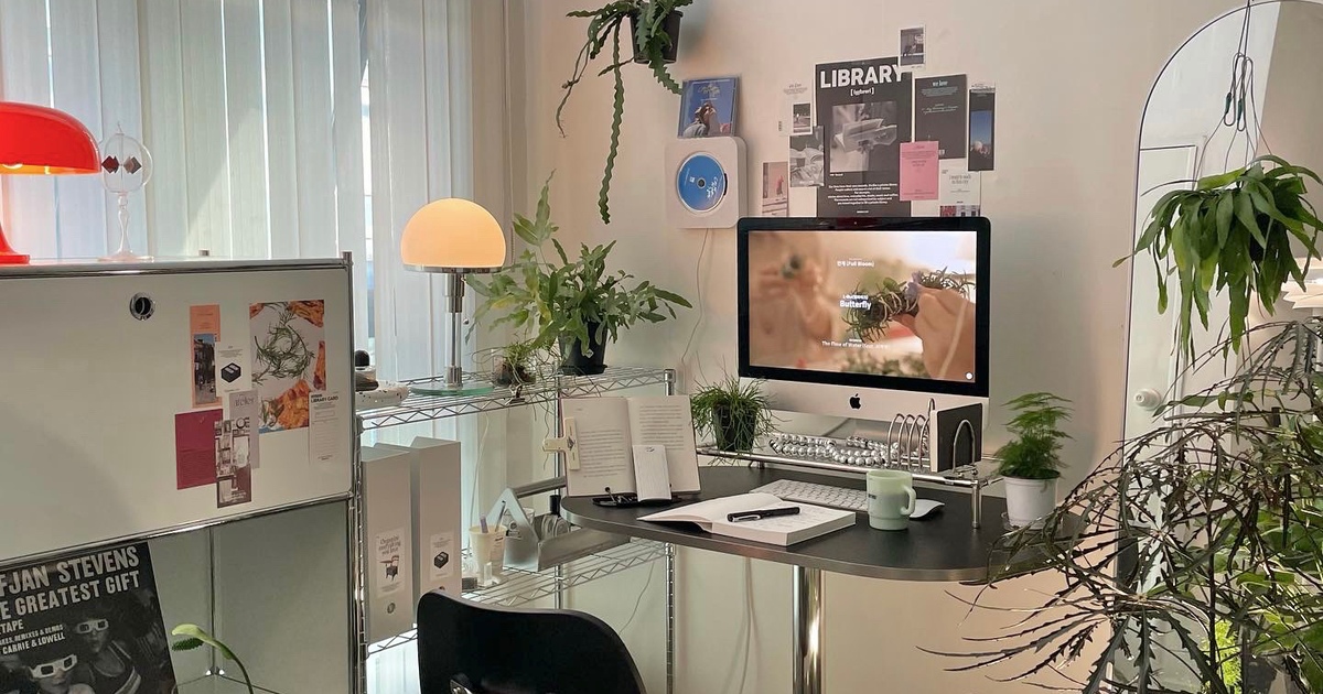 Black monitor stand keeps desk tidy